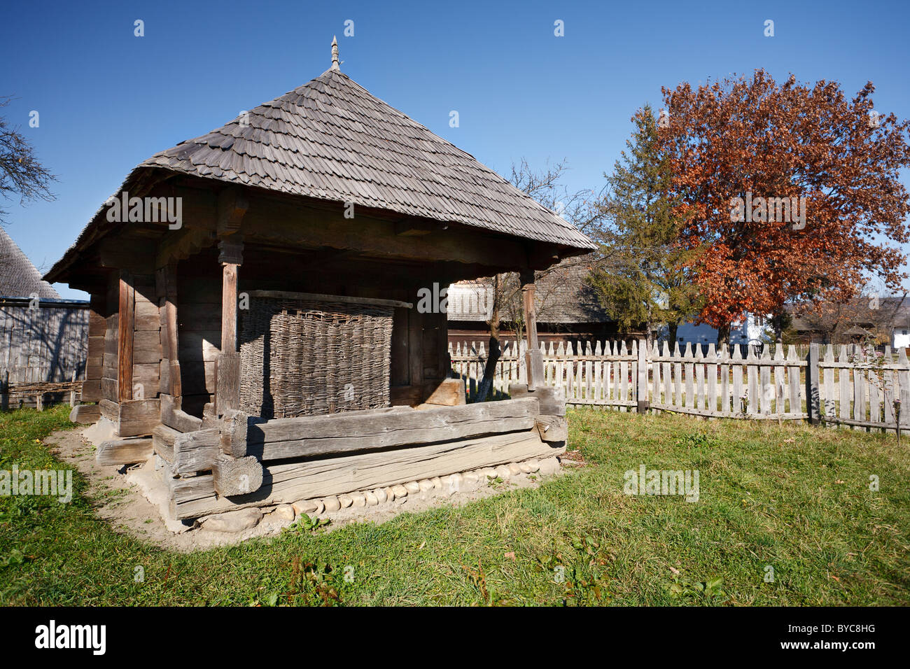 Old traditional Romanian barn or shack under blue sky - this is part of ...