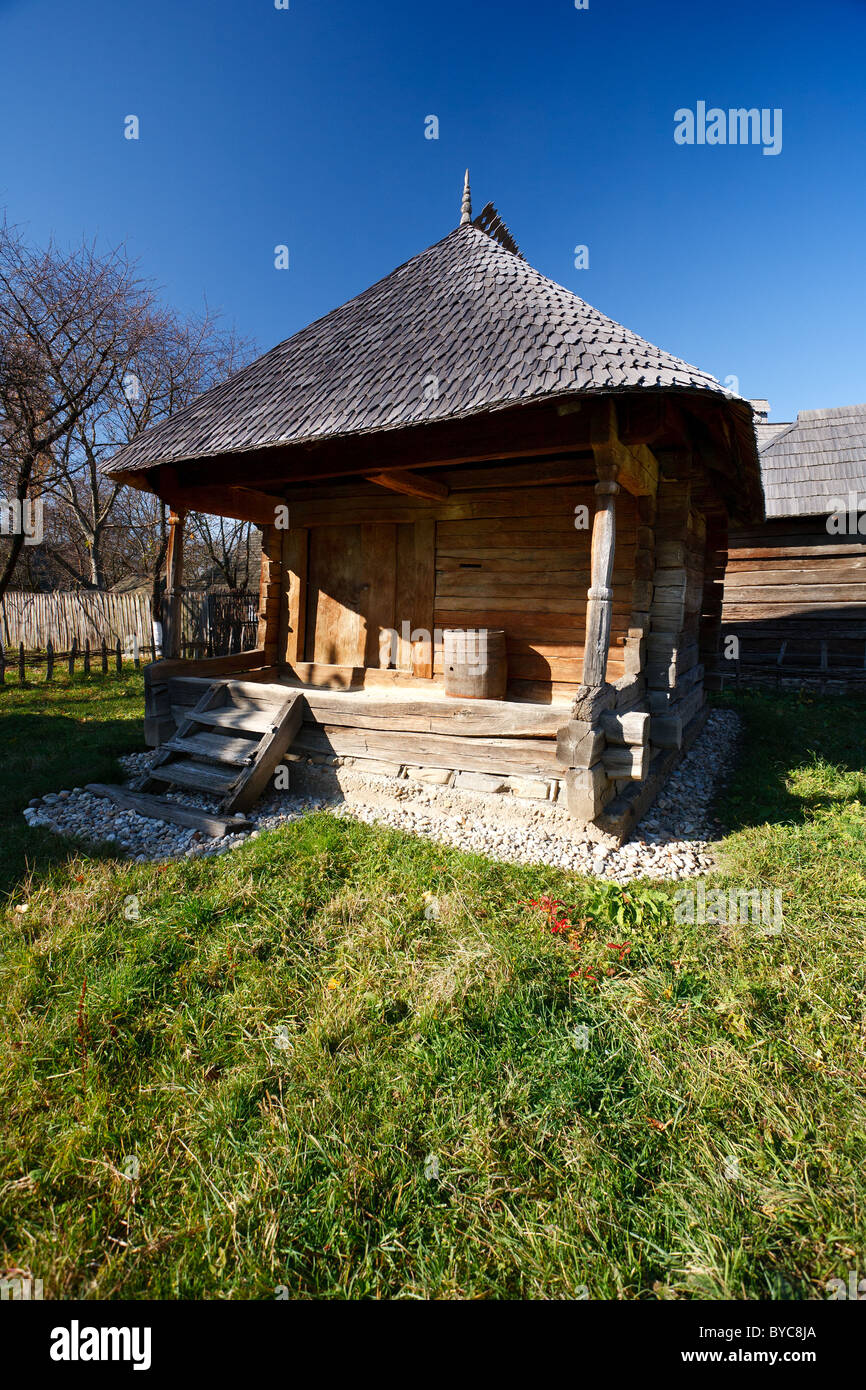 Old traditional Romanian barn or shack under blue sky - this is part of ...