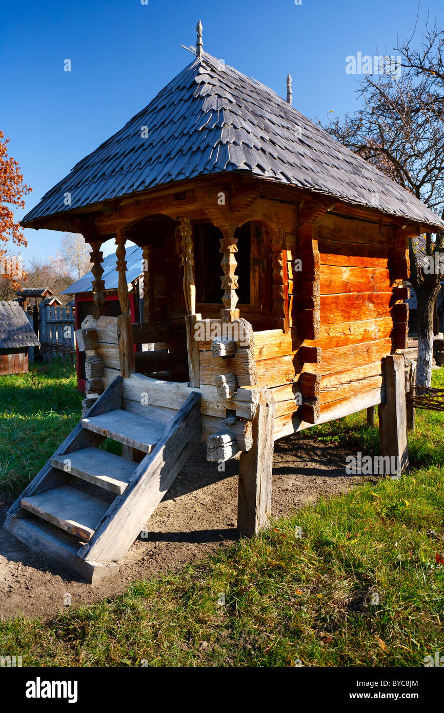 Old traditional Romanian barn or shack under blue sky - this is part of ...