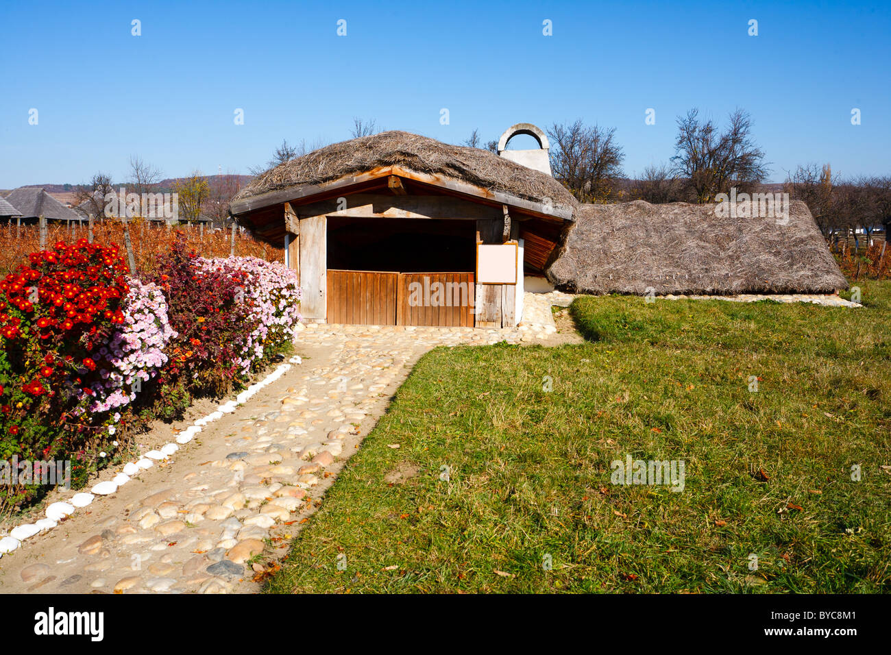 Old traditional Romanian barn or shack under blue sky - this is part of ...