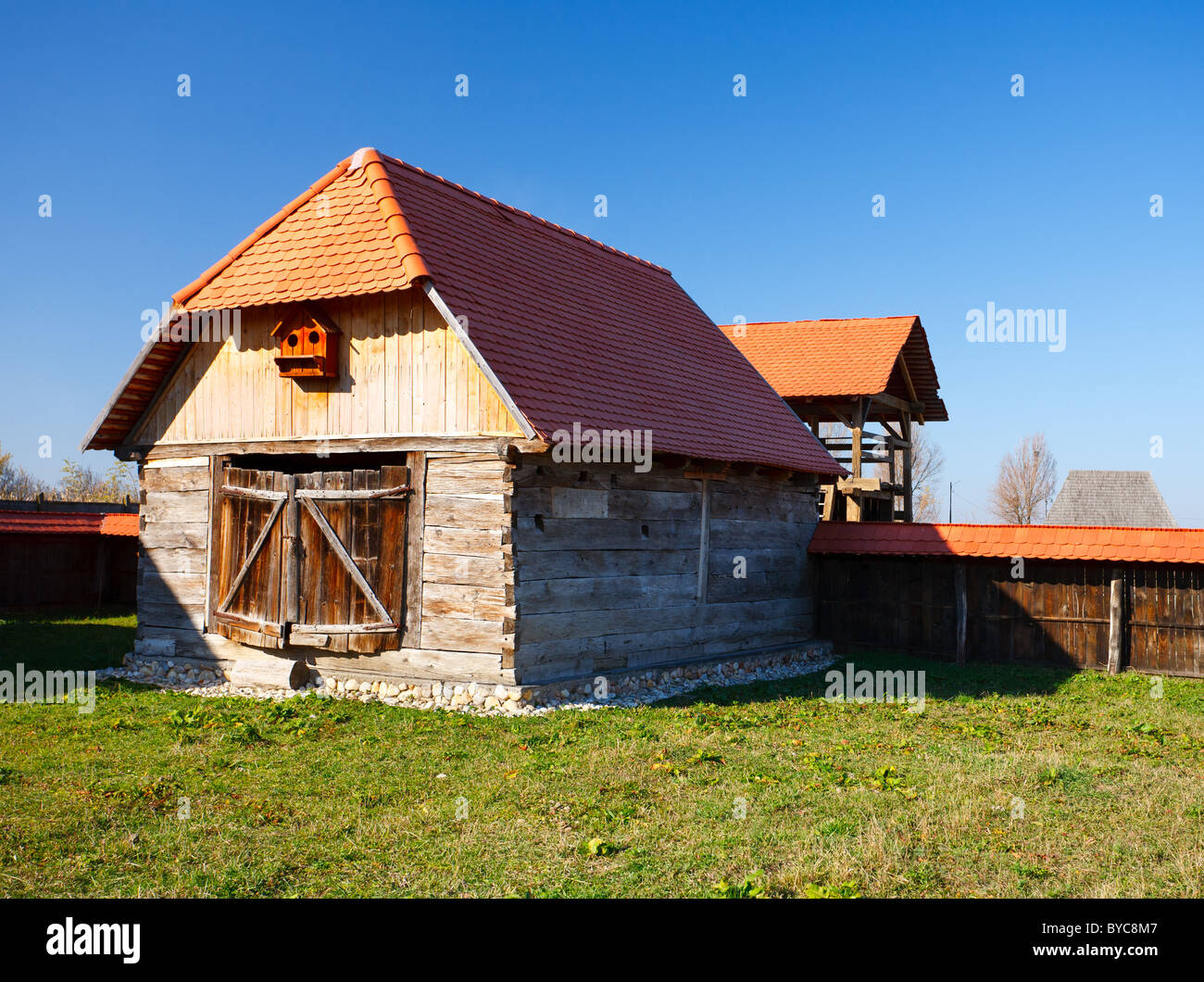 Old traditional Romanian barn or shack under blue sky - this is part of ...