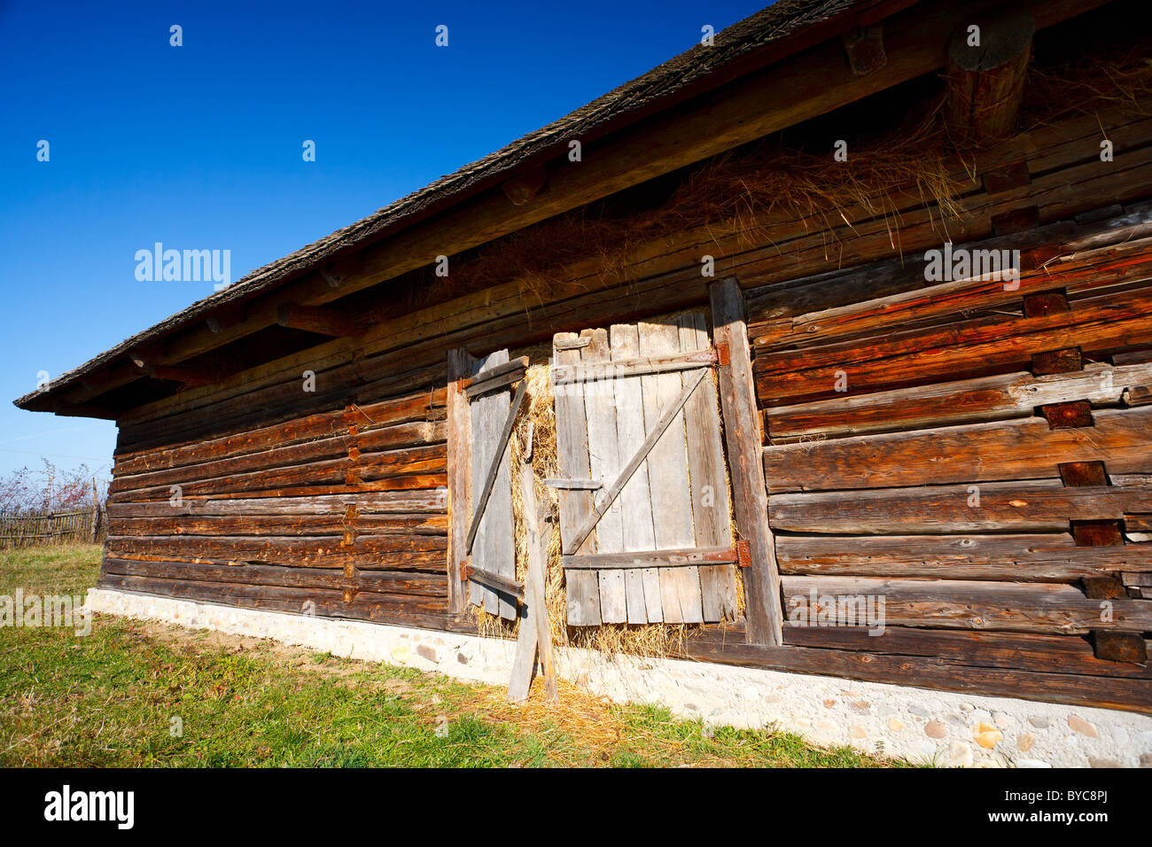 Old traditional Romanian barn or shack under blue sky - this is part of ...