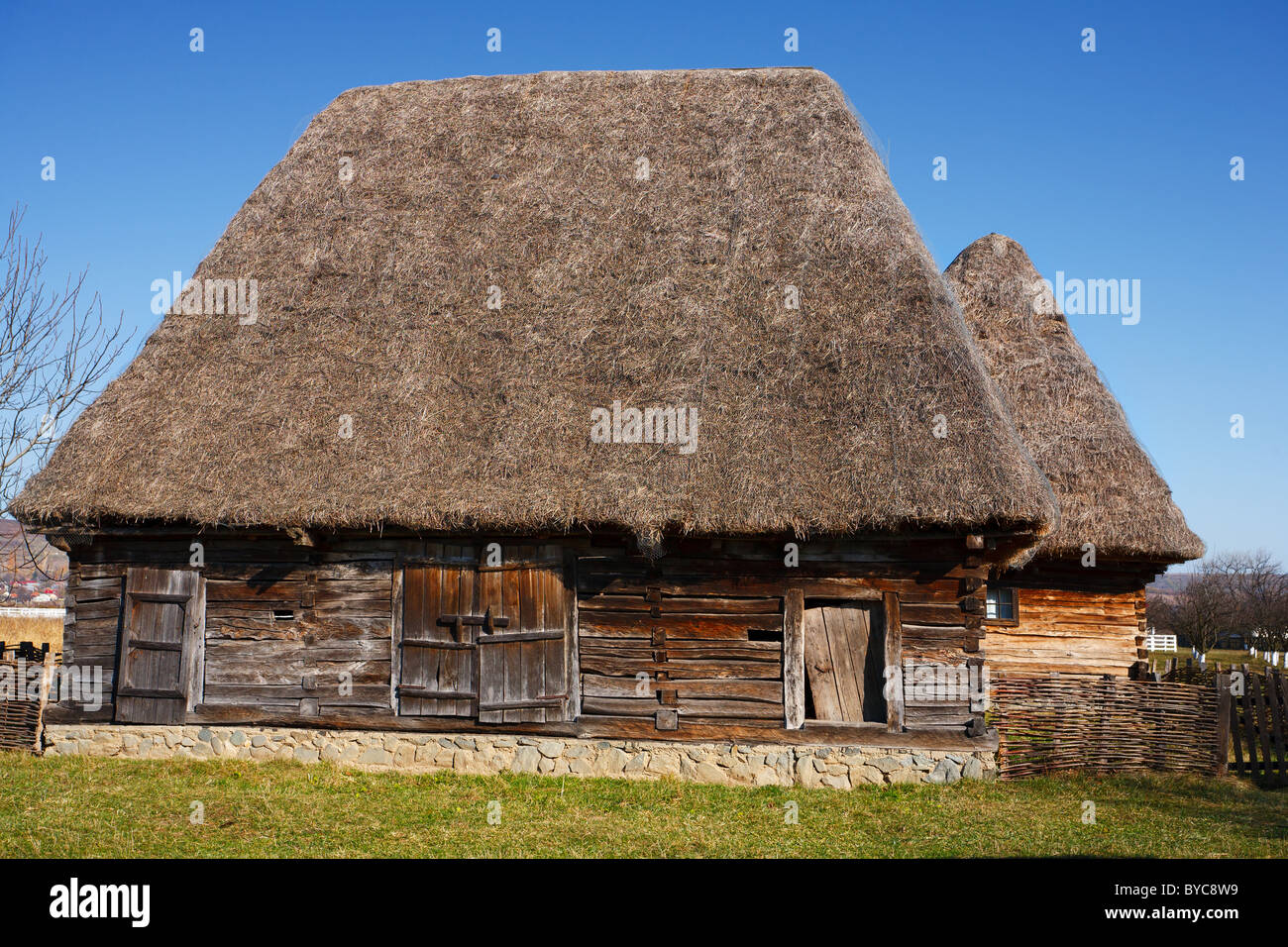 Old traditional Romanian barn or shack under blue sky - this is part of ...