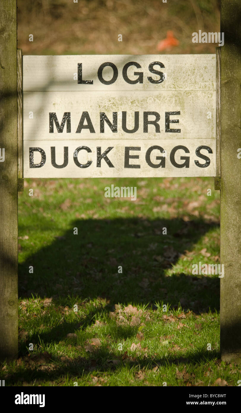 Free range produce, Logs, Manure duck eggs sign Stock Photo - Alamy