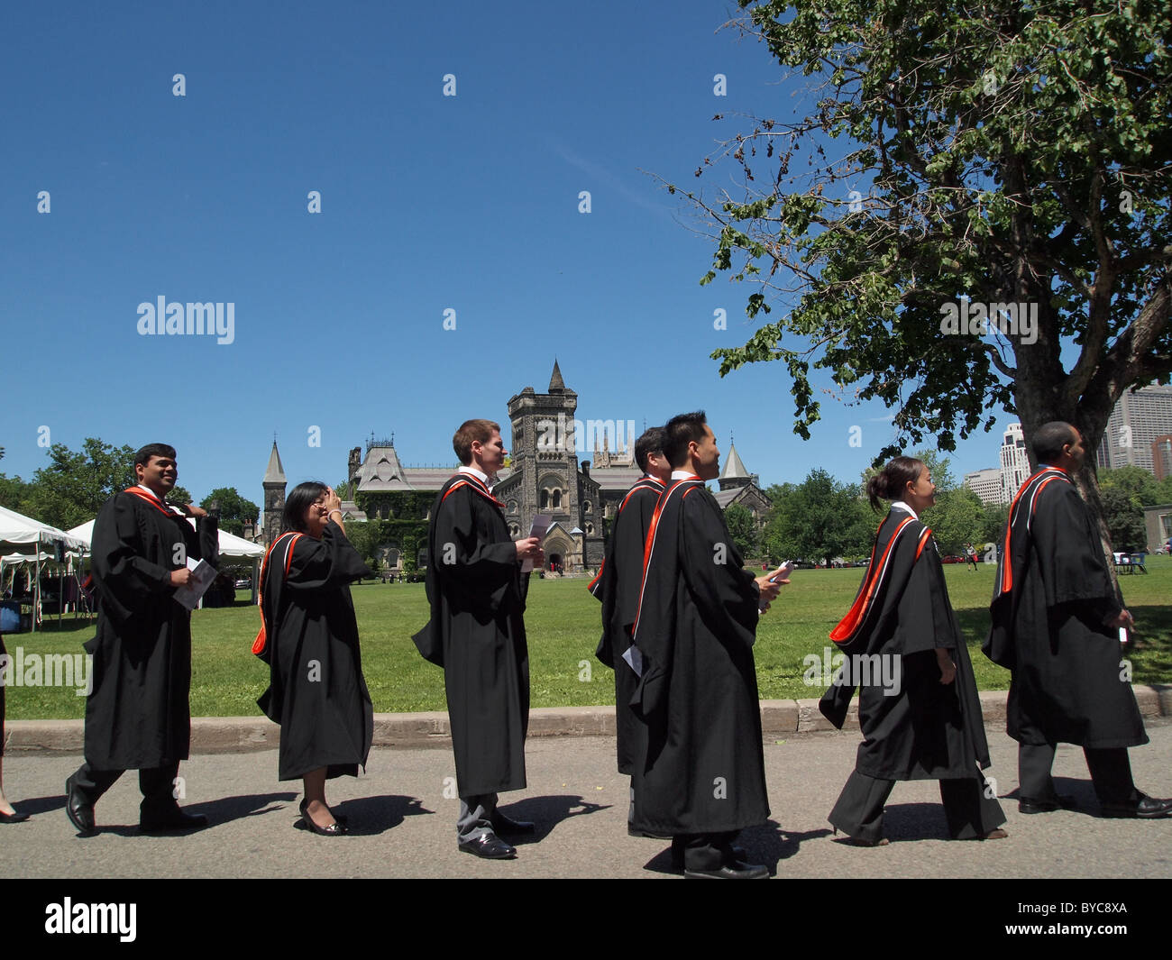 University graduates in line to receive diplomas Stock Photo - Alamy