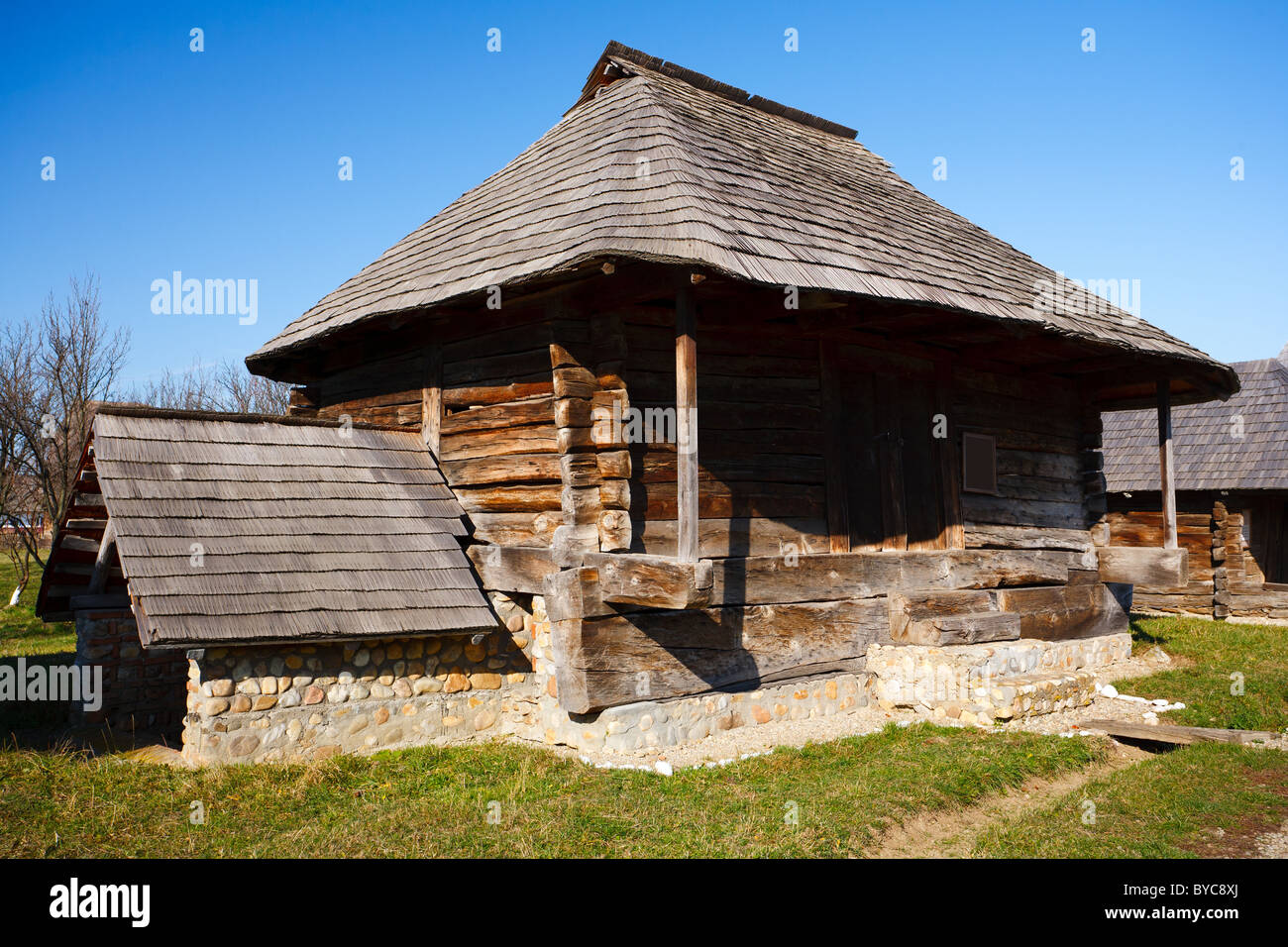 Old traditional Romanian barn or shack under blue sky - this is part of ...