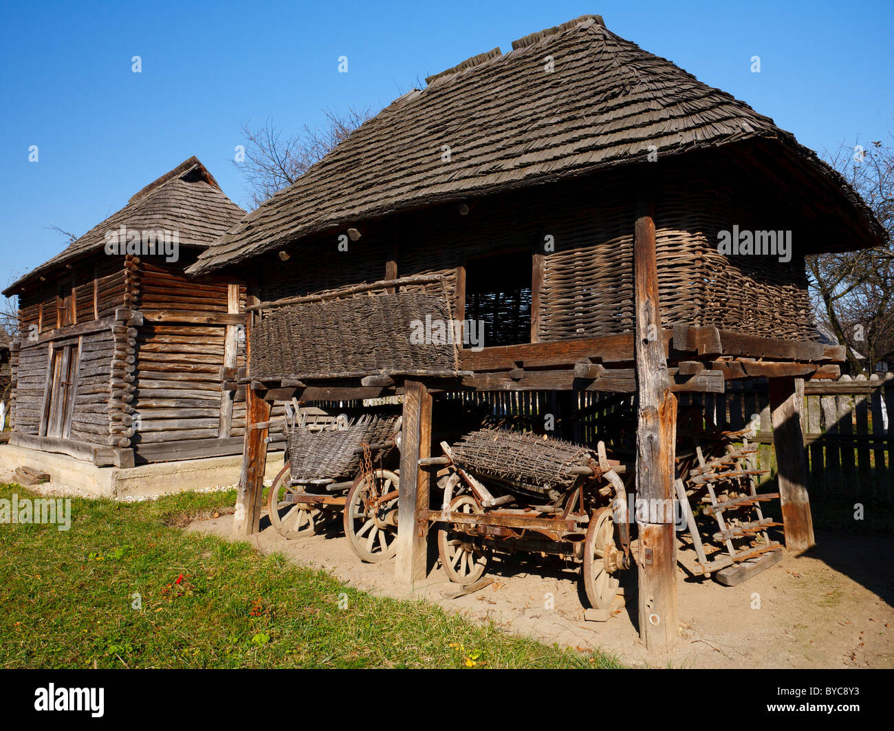 Old traditional Romanian barn or shack under blue sky - this is part of ...