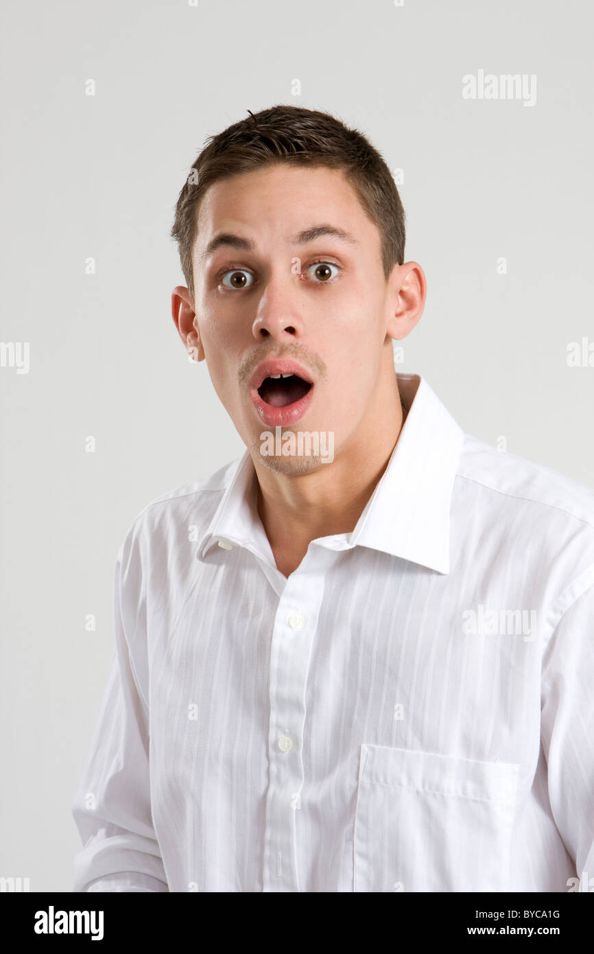 A young man has a look of surprise and amazement on his face Stock ...