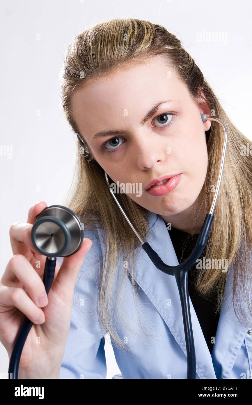 A young female nurse gets ready to use a stethoscope Stock Photo - Alamy