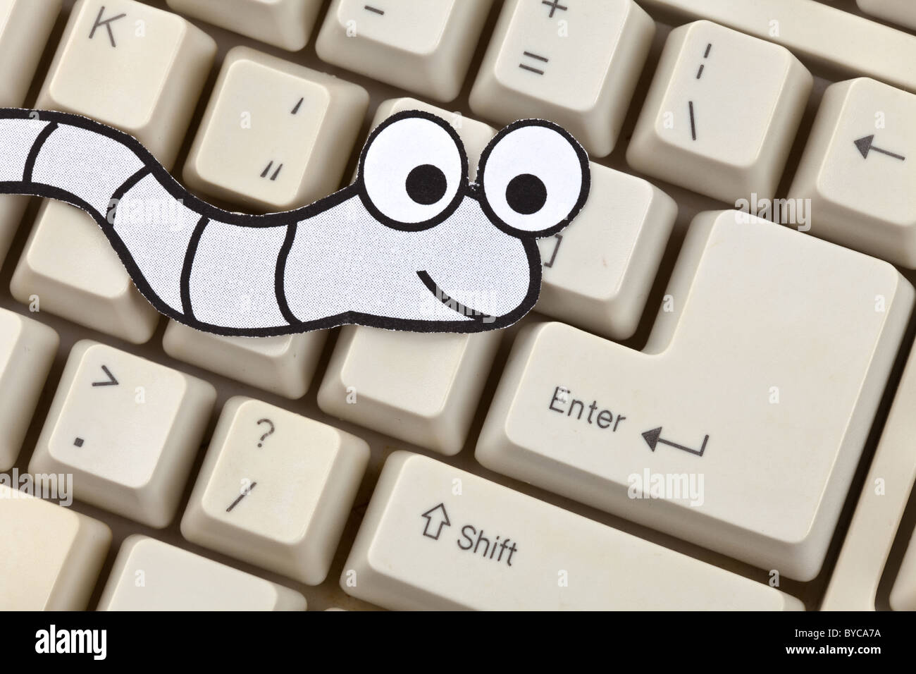 Worm and computer keyboard, concept of Security, Virus Stock Photo - Alamy