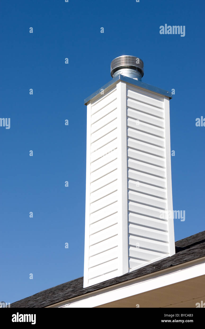 Prefabricated chimney on a recently constructed home rooftop Stock ...