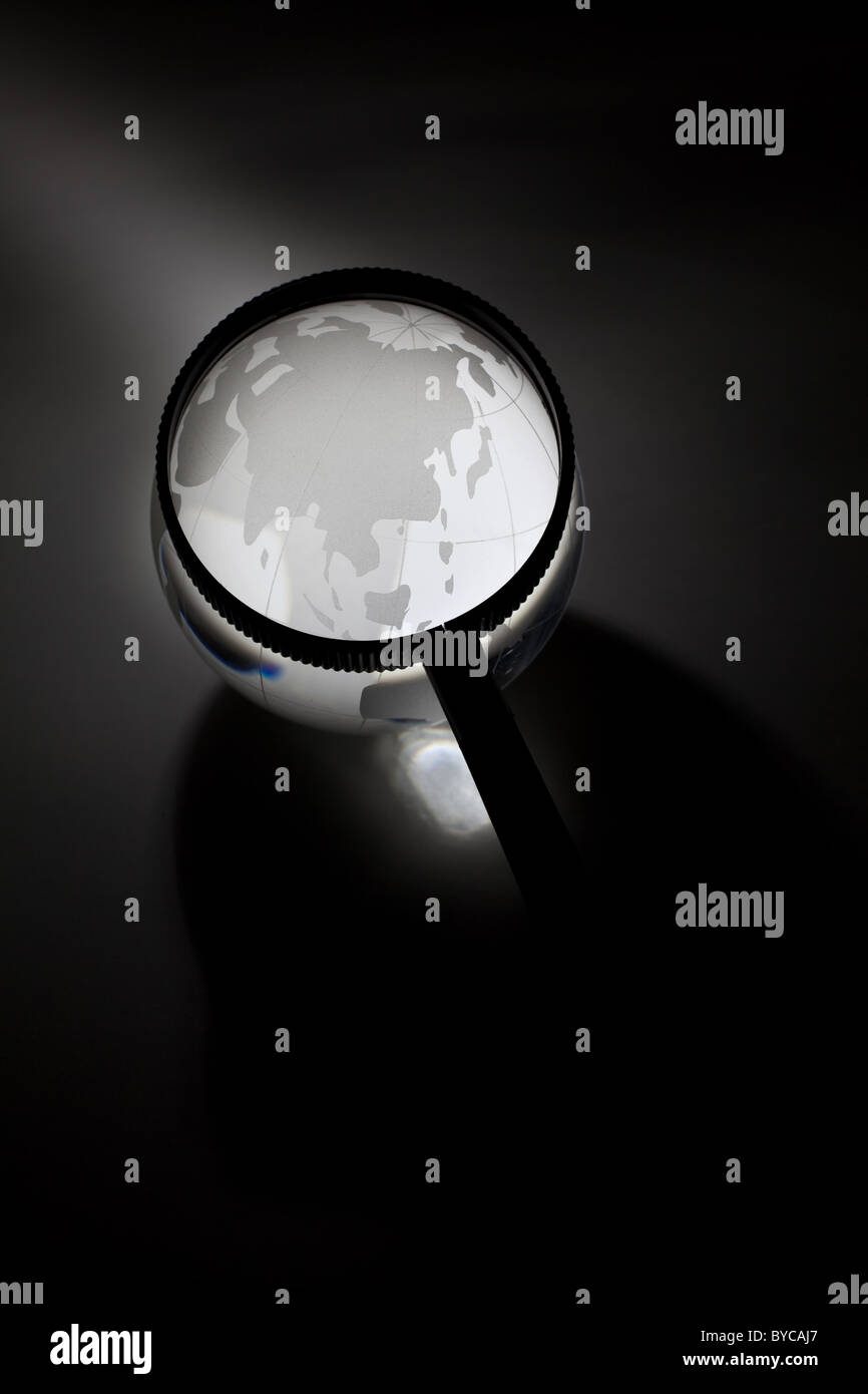 Magnifying glass globe hi-res stock photography and images - Alamy