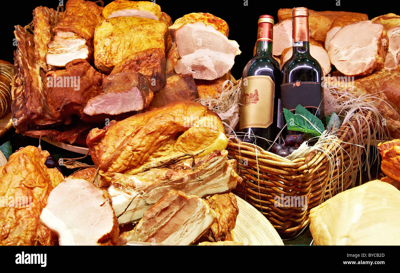 A composition of cold meat with wine bottles in basket Stock Photo - Alamy