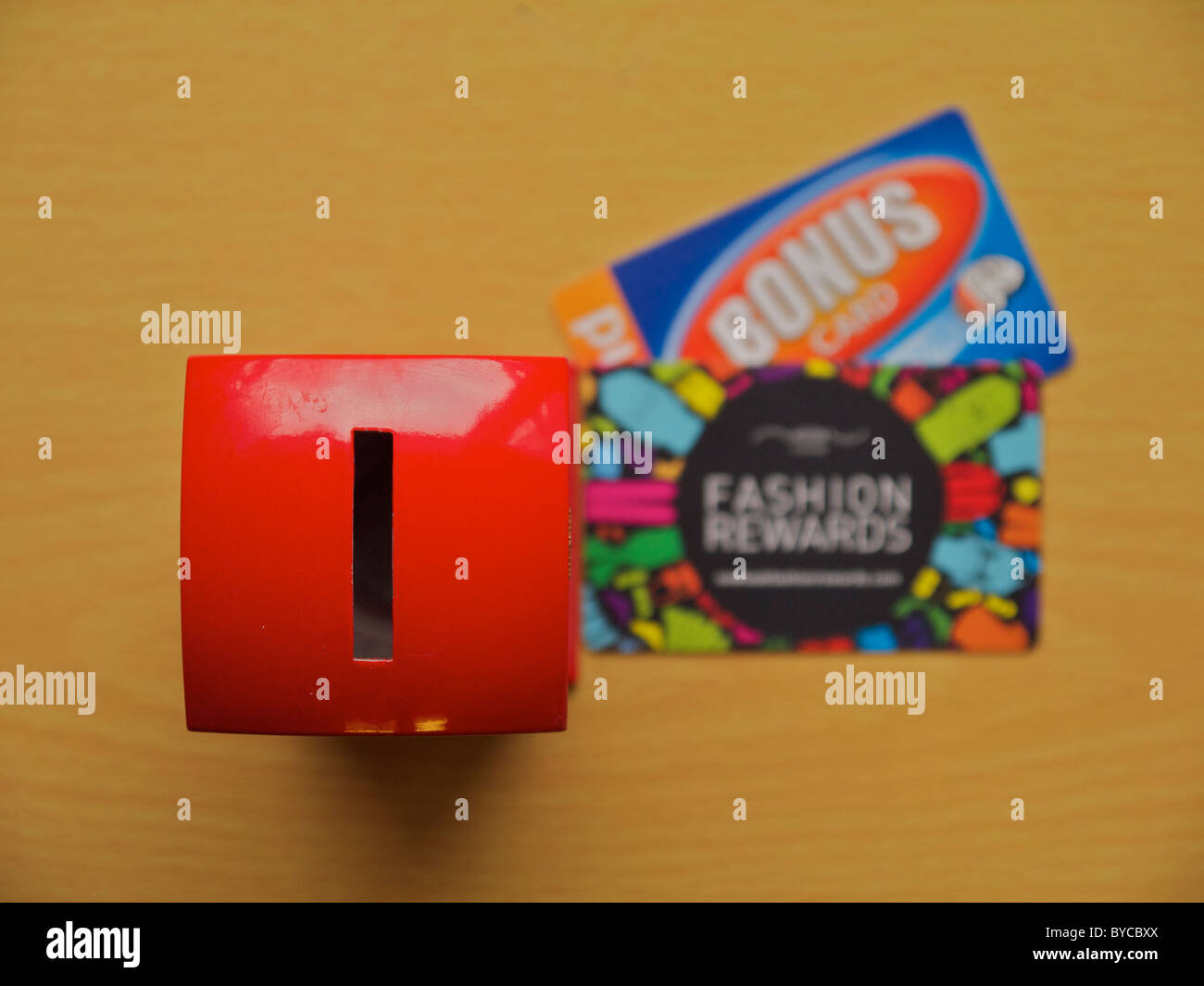 Supermarket reward cards with a money box Stock Photo - Alamy