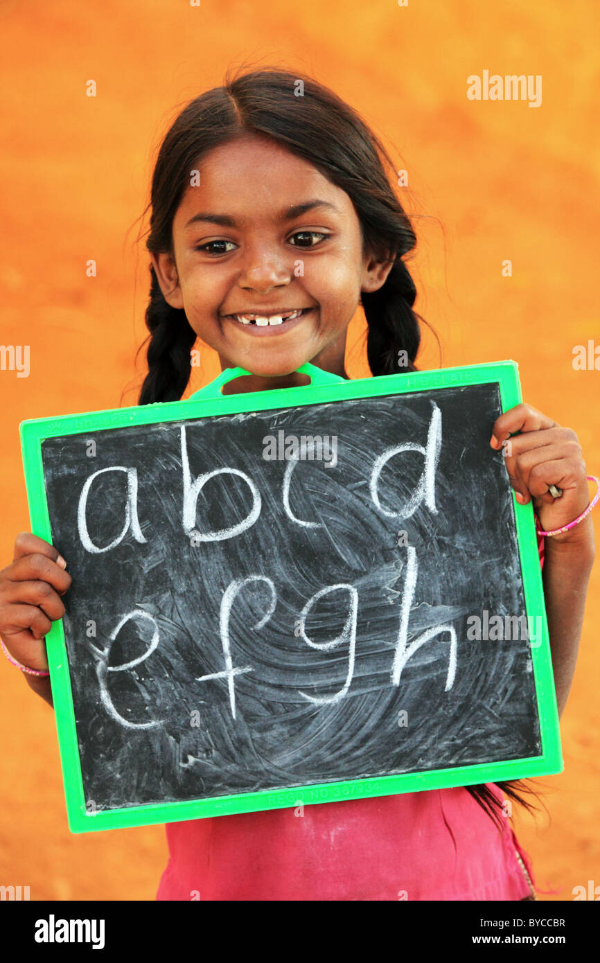 Children holding alphabet letters hi-res stock photography and images ...