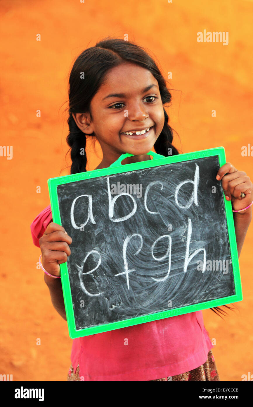 Children holding alphabet letters hi-res stock photography and images ...