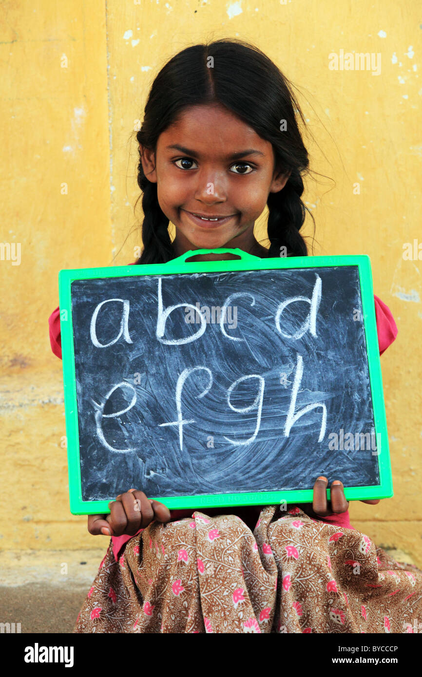 Children holding alphabet letters hi-res stock photography and images ...