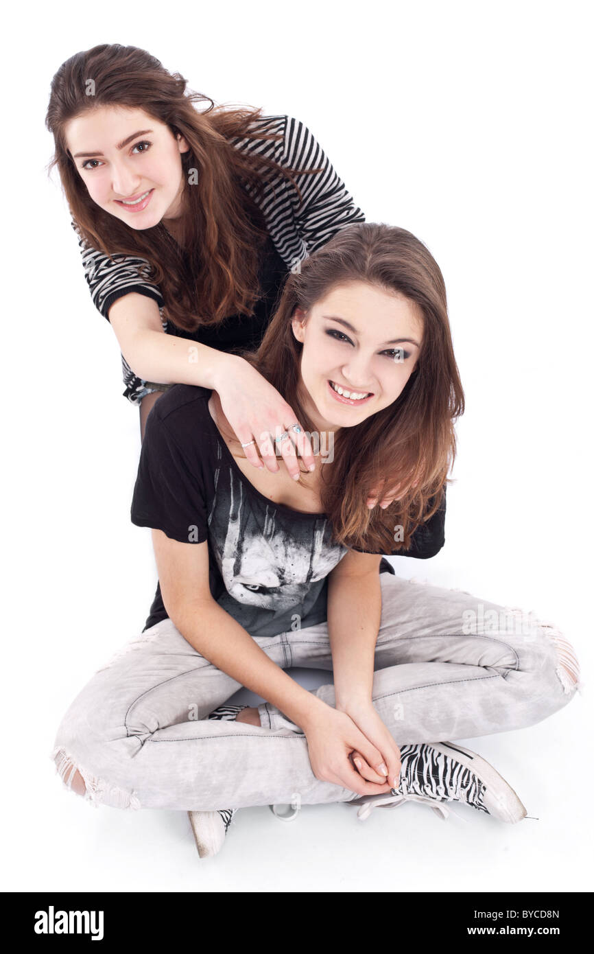 Two friends talking to each other. The image is isolated on a white ...