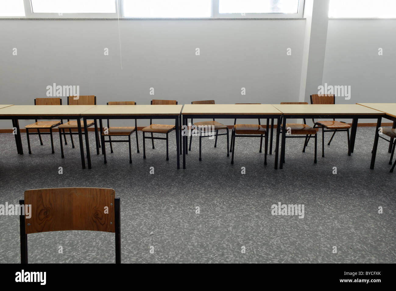 Desks and chairs at an empty classroom Stock Photo - Alamy