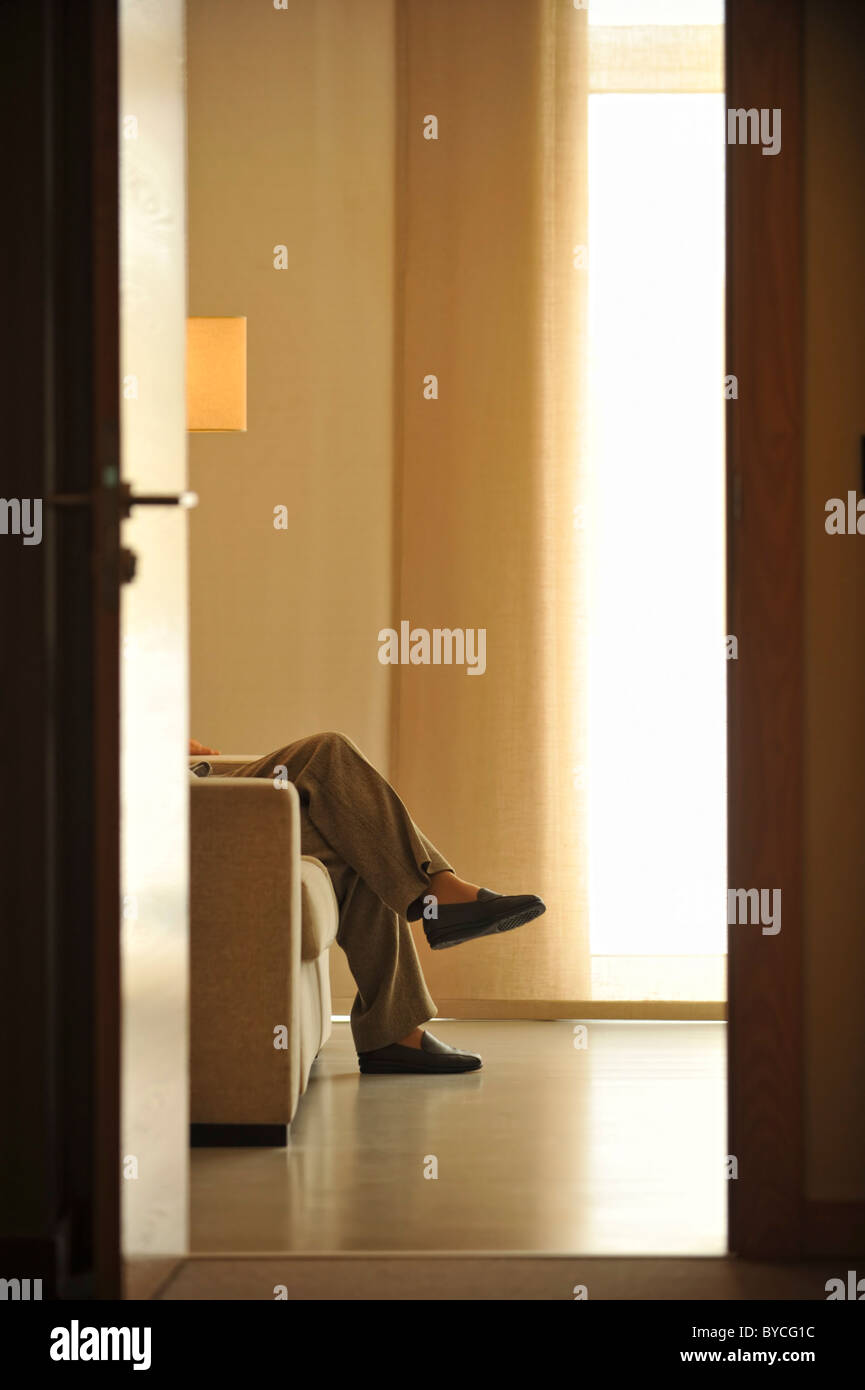 Person sitting in a waiting room Stock Photo - Alamy