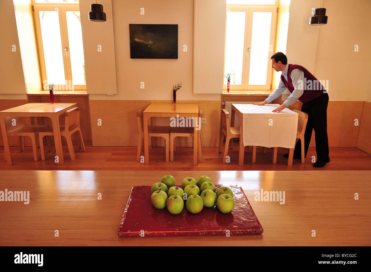 Waiter laying the table at a restaurant Stock Photo - Alamy