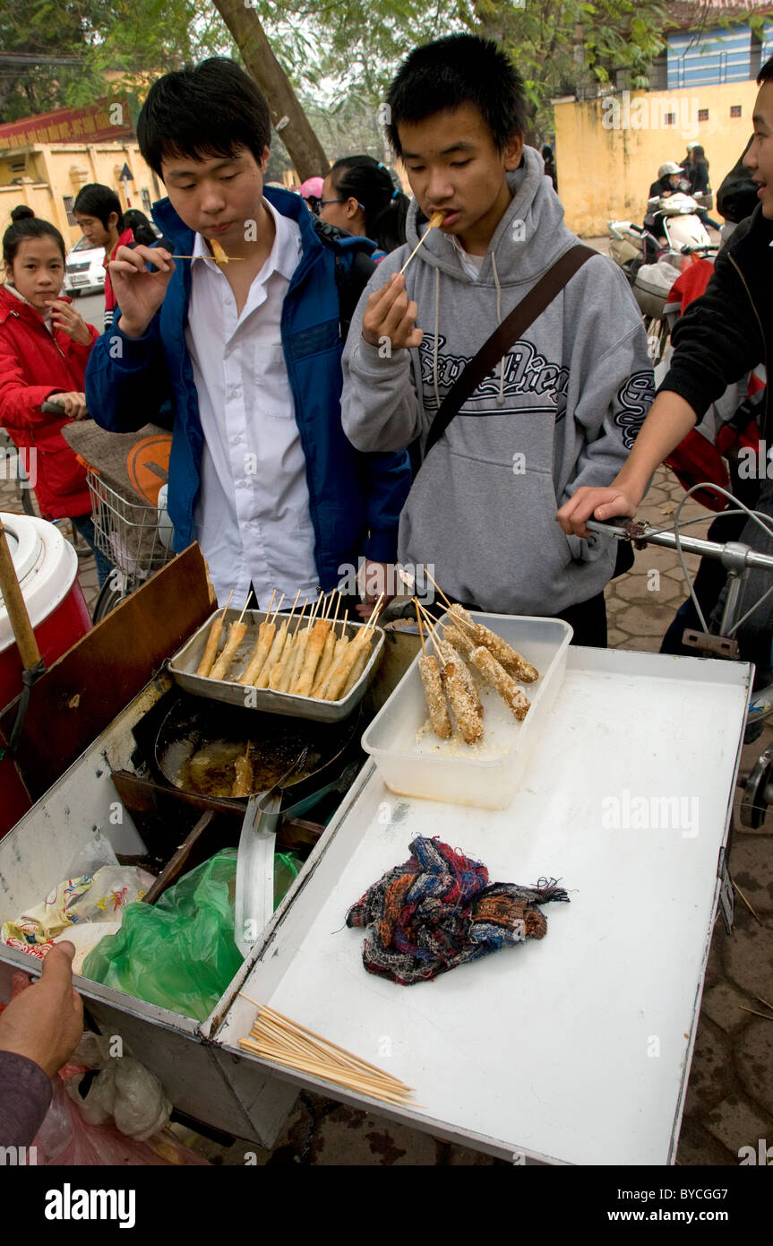 Eating street snacks Stock Photo - Alamy