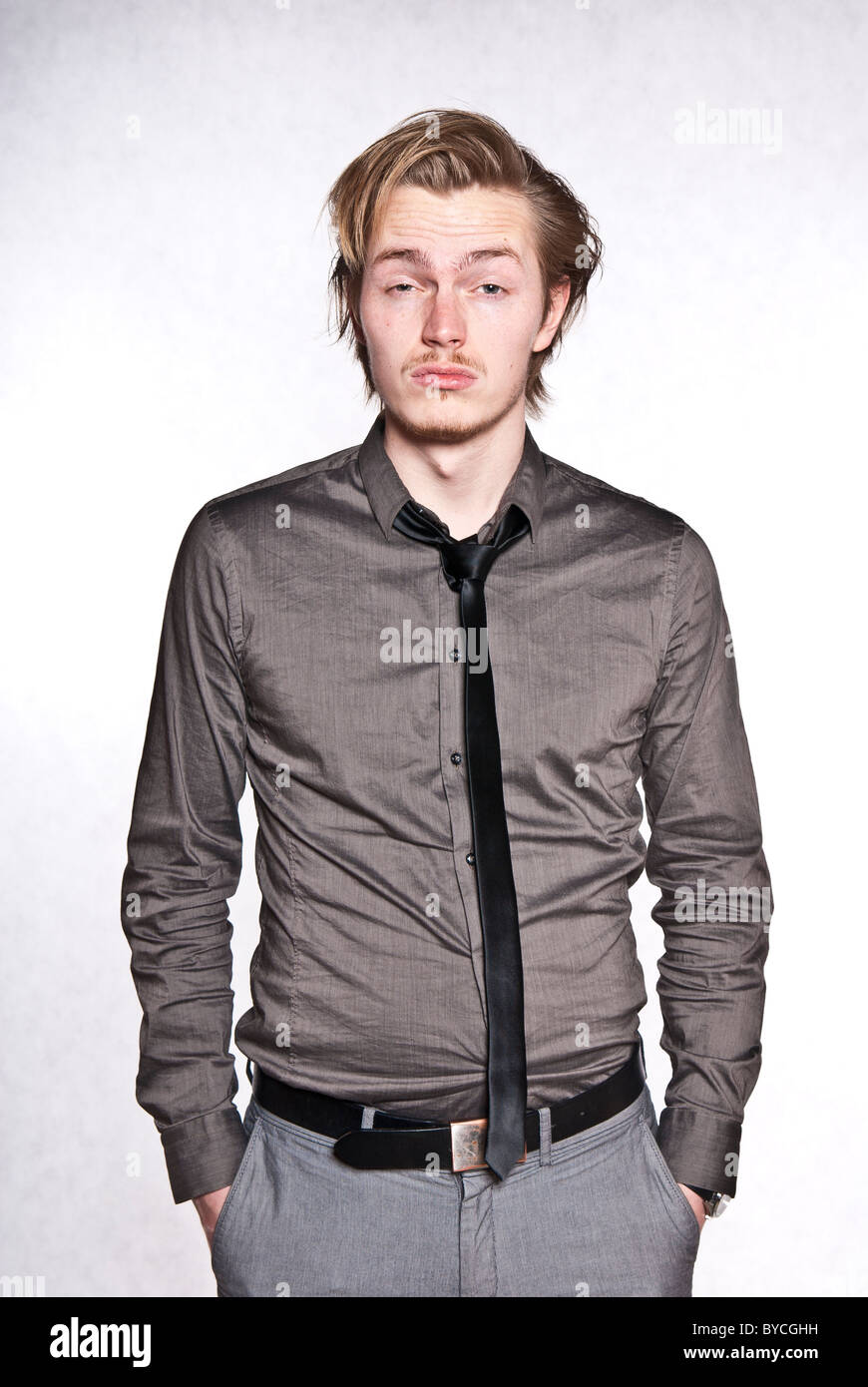 Young man expression portrait. Studio photo of young man making a funny ...