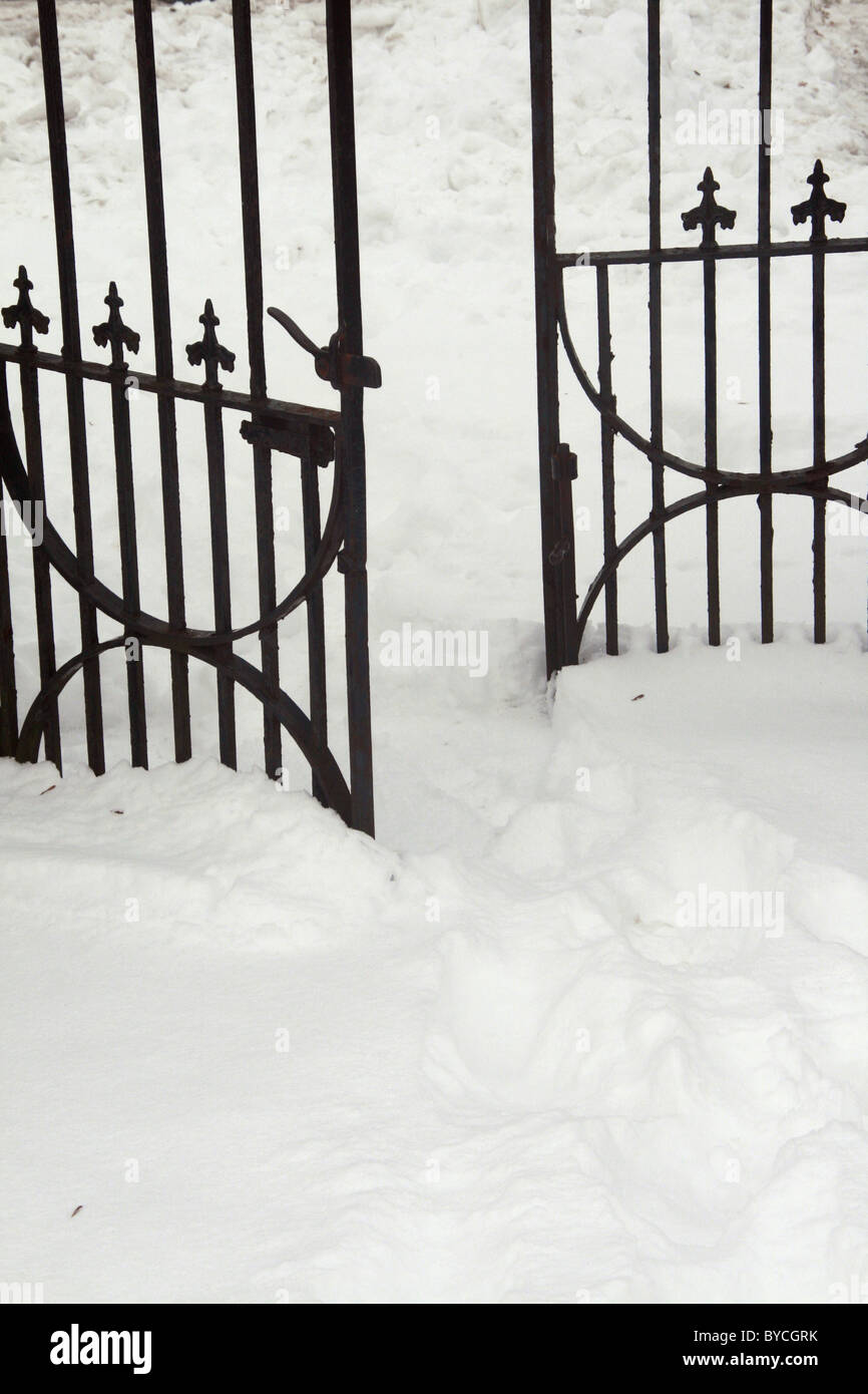 wrought iron gate in thick snow Stock Photo - Alamy