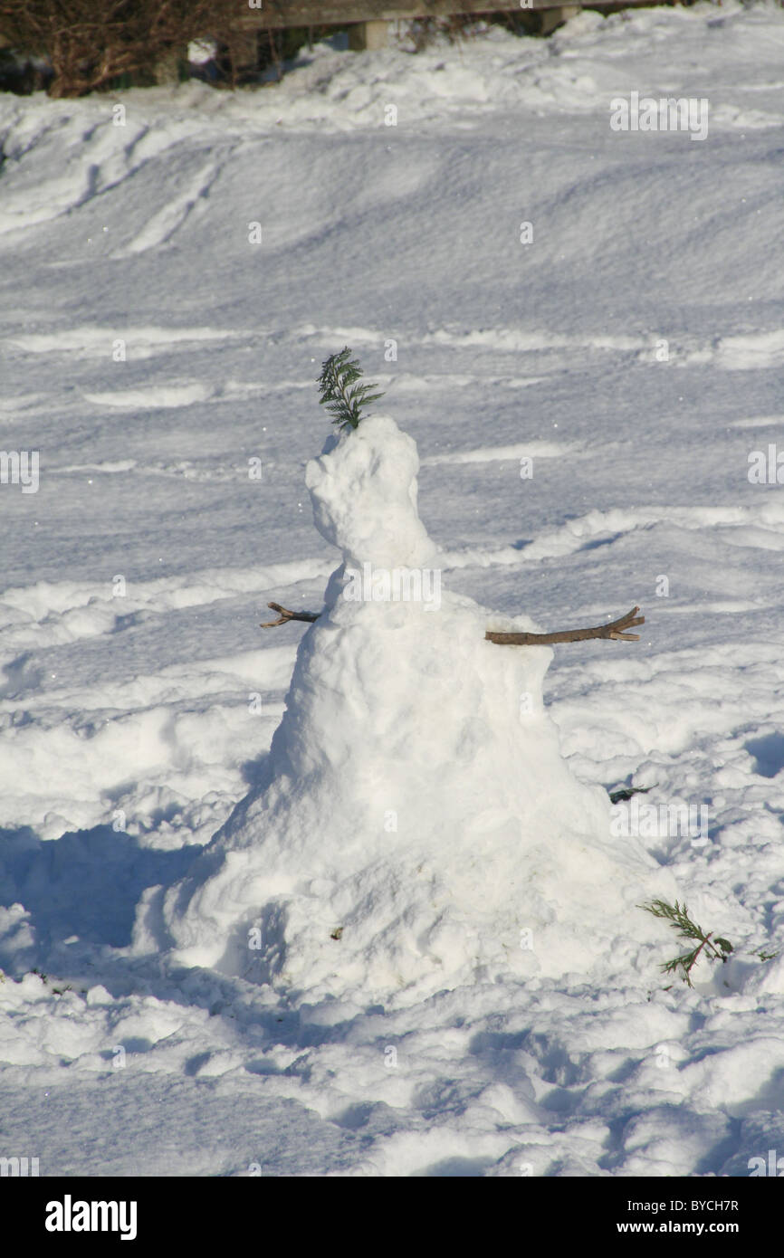 Snowman with sticks for arms hi-res stock photography and images - Alamy