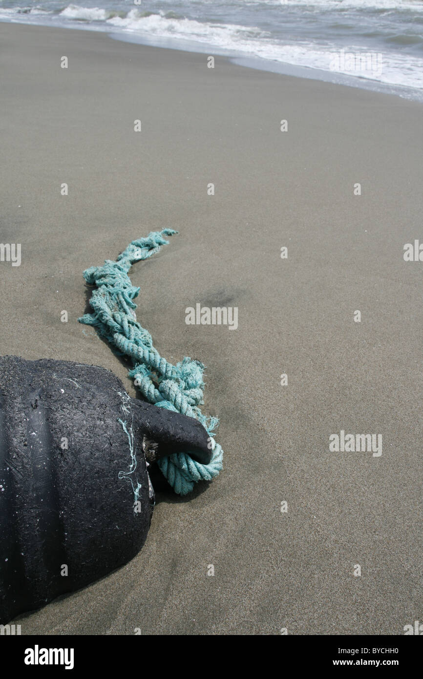 buoy washed up on sand coast shore by sea Stock Photo - Alamy