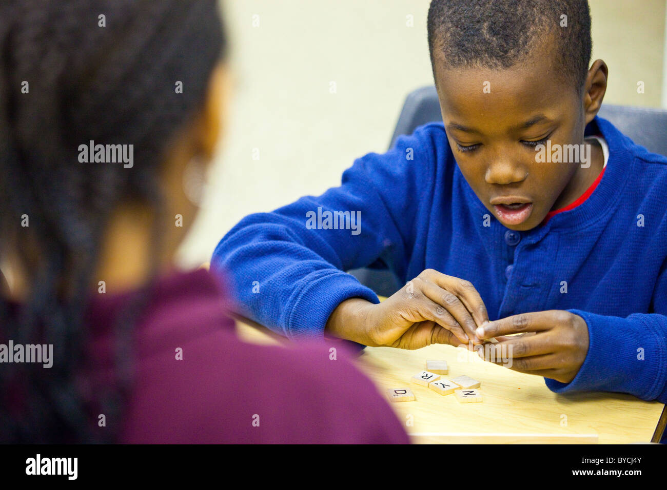 Playing scrabble in a classroom in Washington DC Stock Photo - Alamy