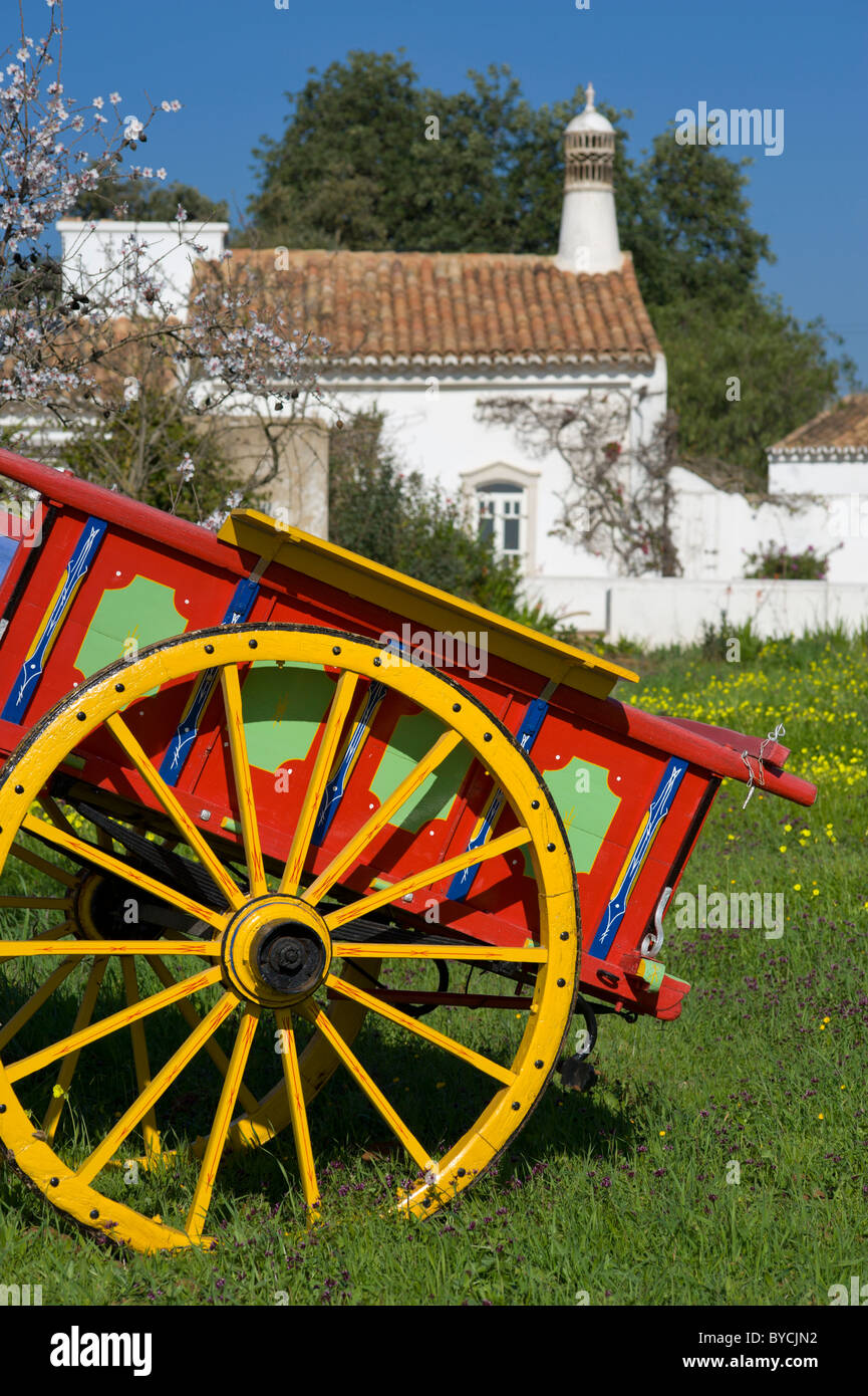 Portugal, the Algarve, rustic painted cart outside farmhouse Stock ...