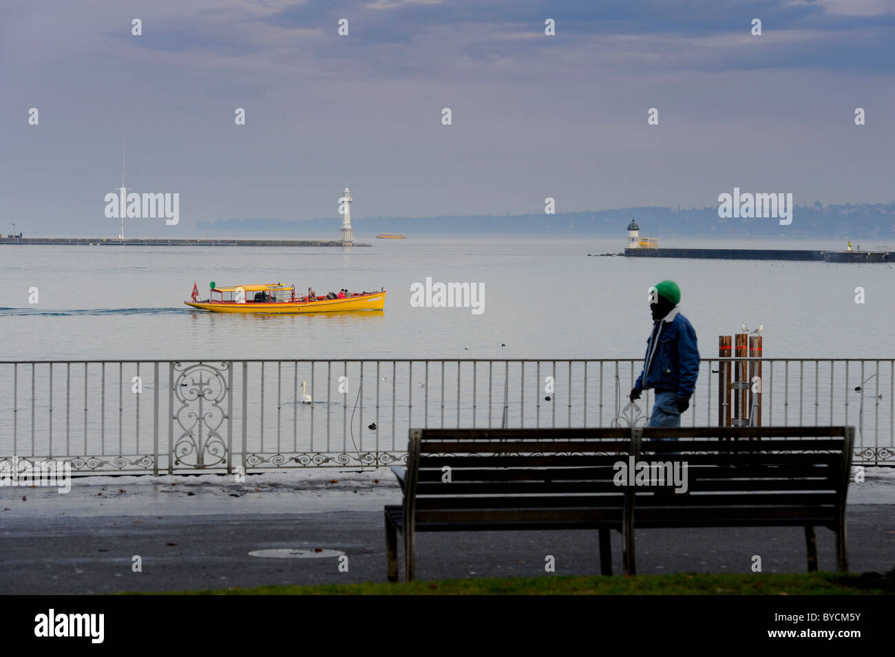 City waterfront with boat passing by hi-res stock photography and ...