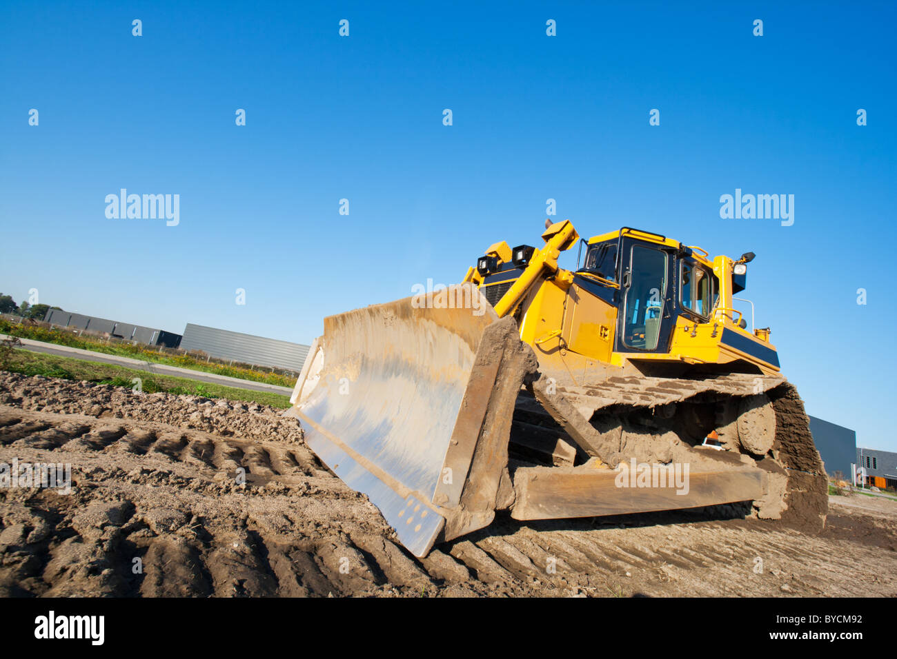 Yellow bulldozer at work Stock Photo - Alamy