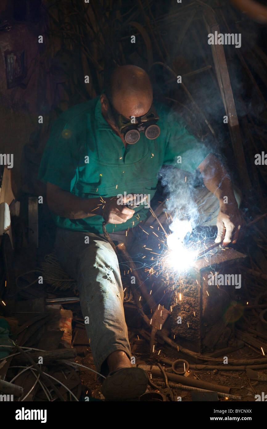 Ironmonger working in the souks, Marrakech medina, Morocco, North ...
