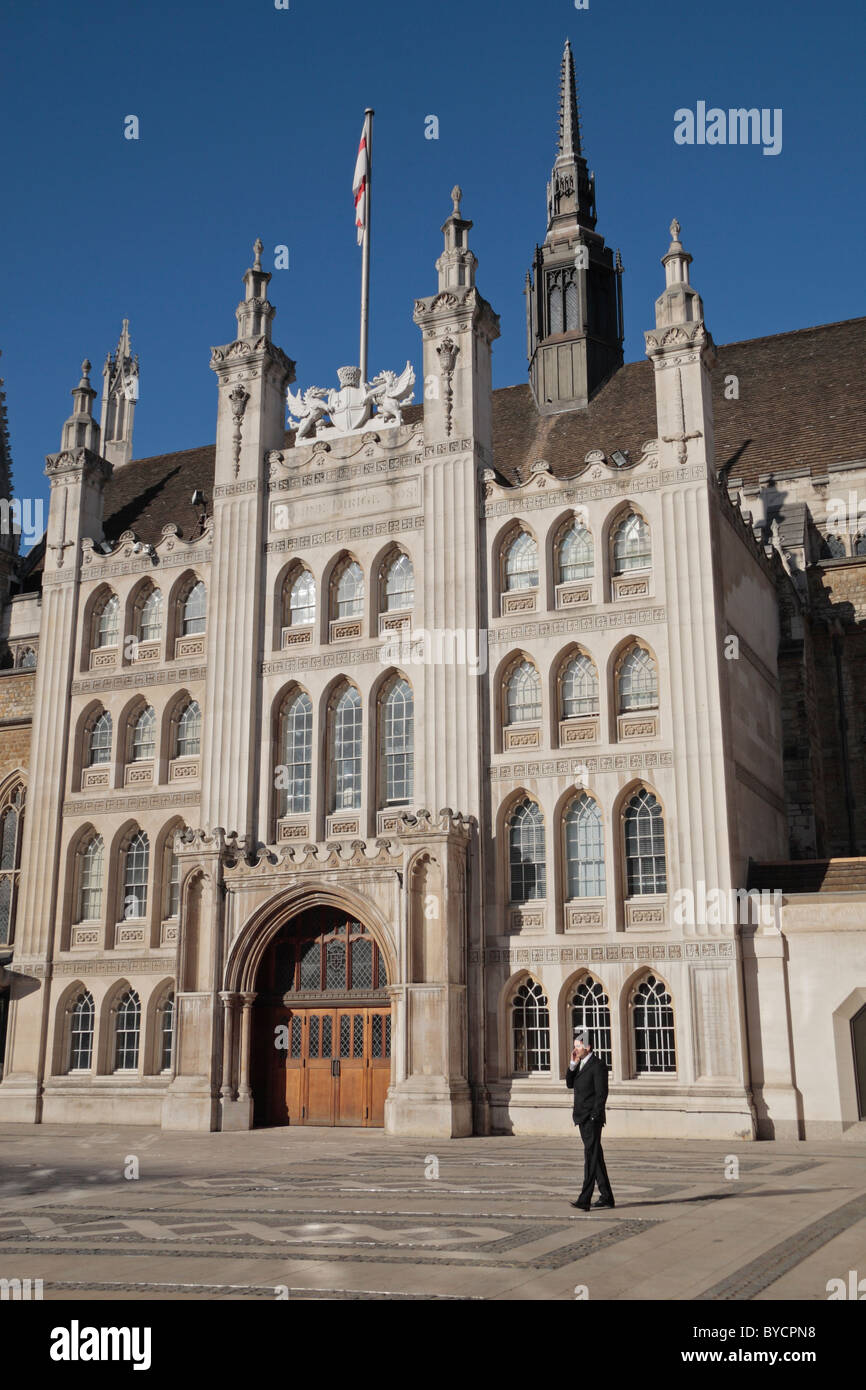 Businessman in front of the facade of the Great Hall, the Guildhall ...