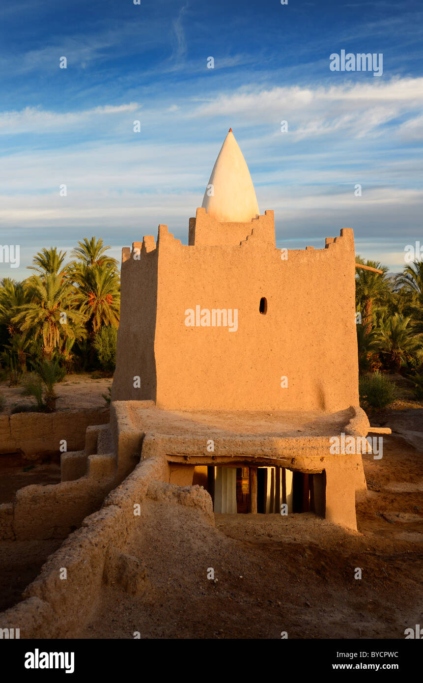 Ancient shrine of a holy man in the Palm tree oasis near Kasbah Ben ...
