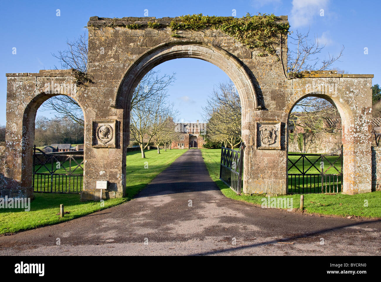 View of the medieval Cothelstone manor through the romanesque arched ...