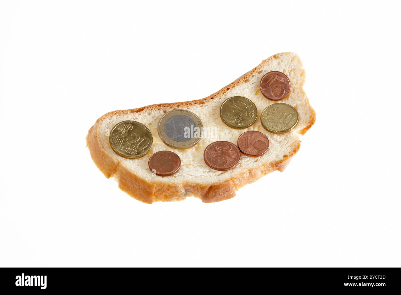 Slice of stale bread with Euro coins on it Stock Photo - Alamy
