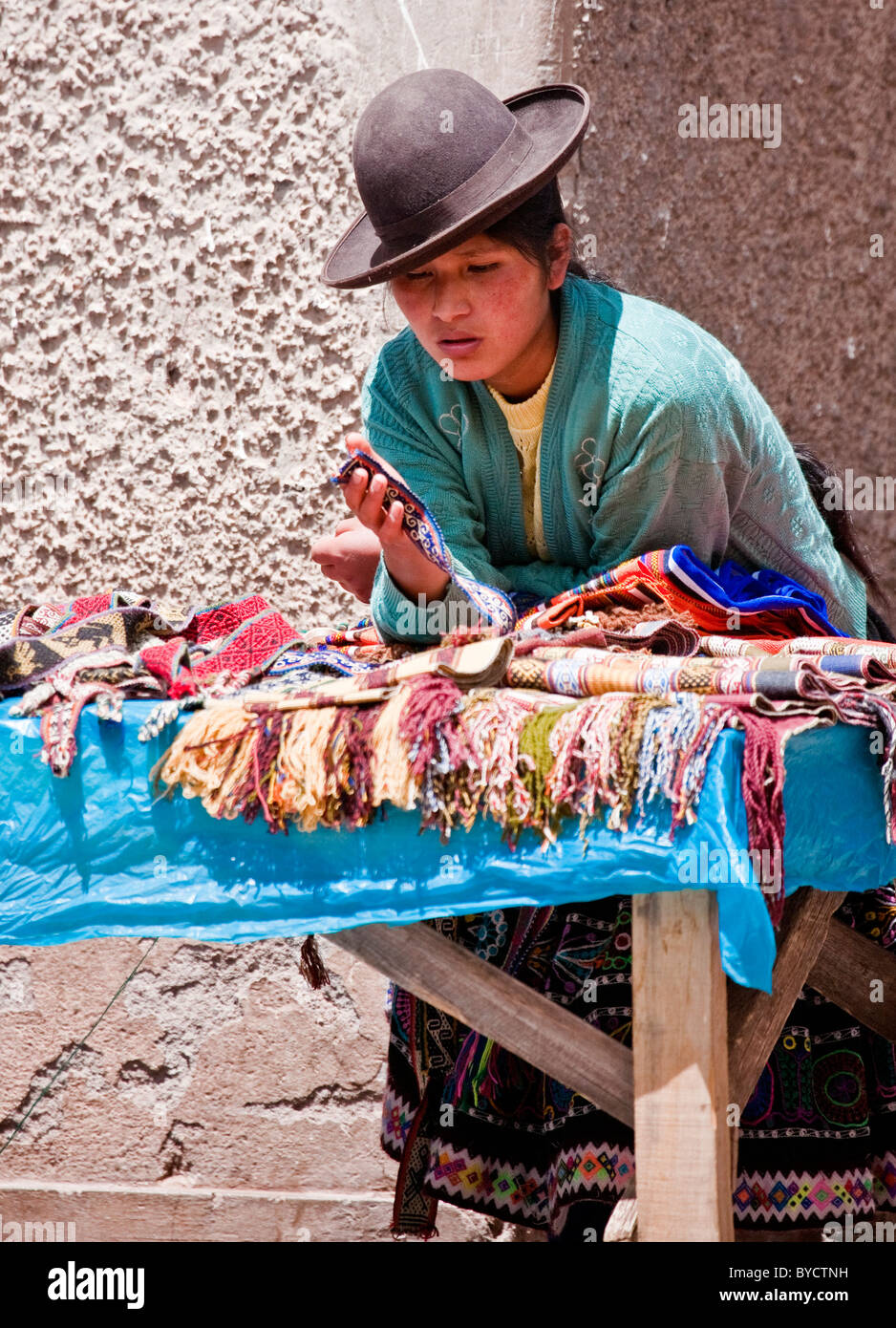lady working in the market at Pisac, Sacred Valley, Peru, South America ...