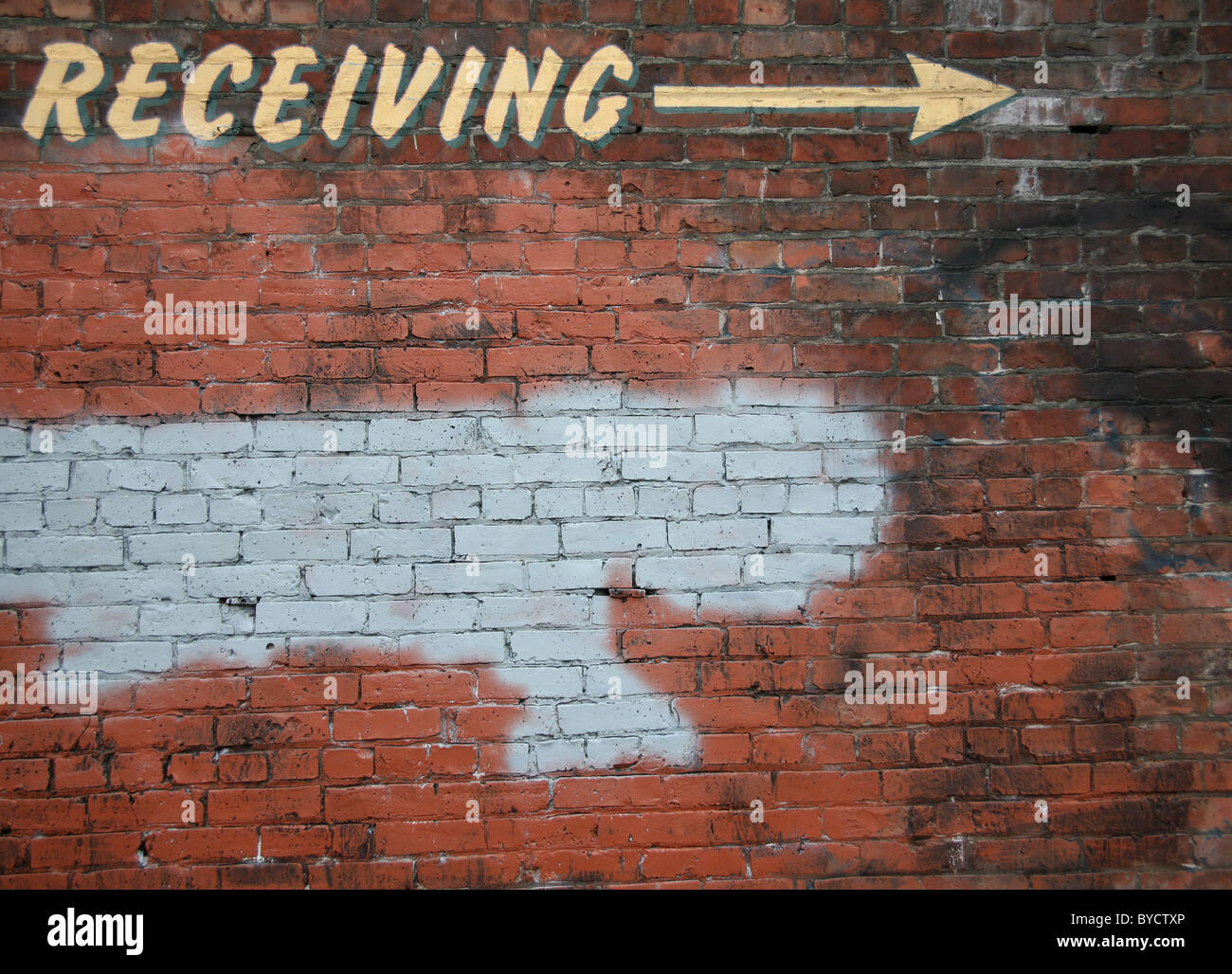 'Receiving' signage on brick wall Stock Photo - Alamy
