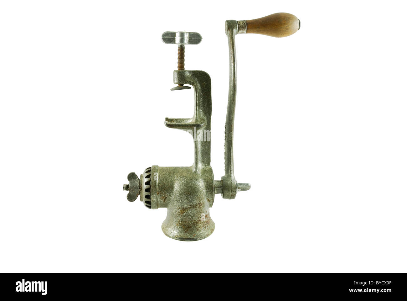 Side view of an antique meat grinder isolated on a white background ...