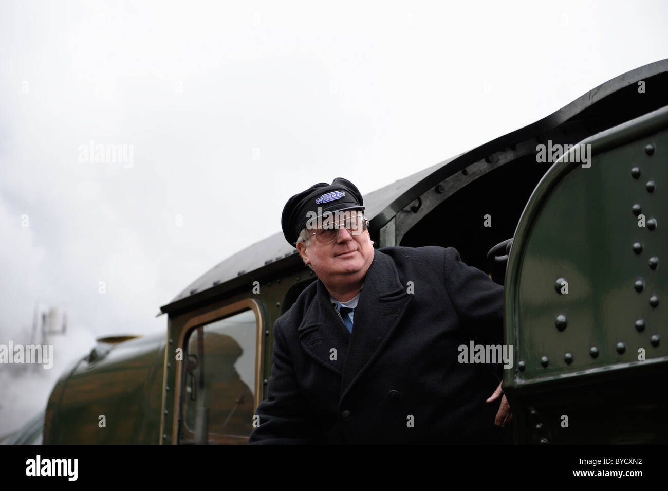 steam train driver looking back on his train great central railway ...