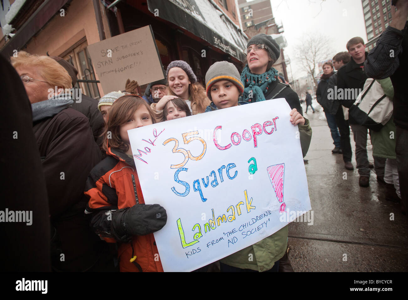 Protesters gather in front of 35 Cooper Square in NY to show their ...