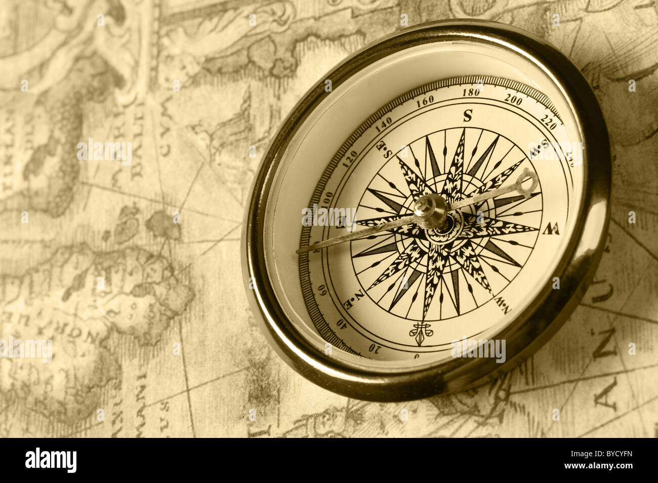 Old compass on ancient map. Old monochrome image Stock Photo - Alamy