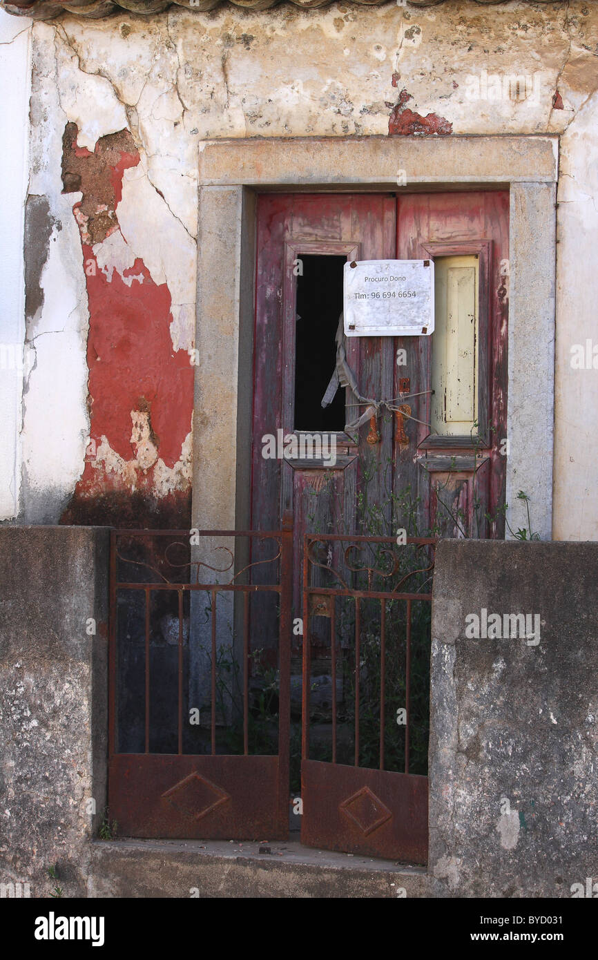 An old poor building where the plaster is falling off the walls in ...