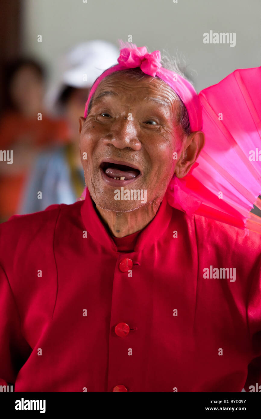 Eighty five year old Chinese man dressed in red and dancing for ... Eighty five year old Chinese man dressed in red and dancing for ...