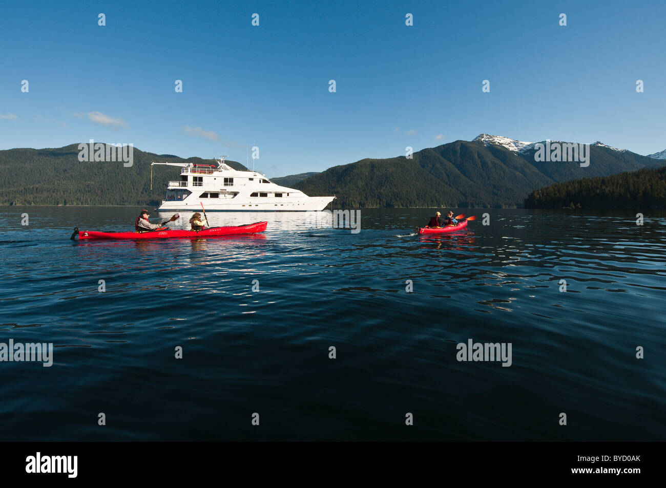 Alaska. Safari Quest and kayakers in Windham Bay in the Chuck River ...