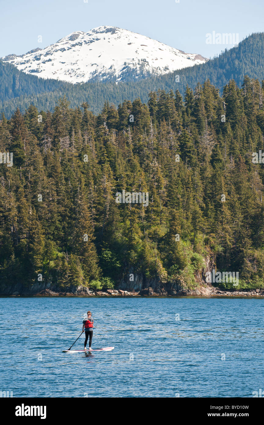 Young woman paddleboarder paddleboarding in Windham Bay in the Chuck ...