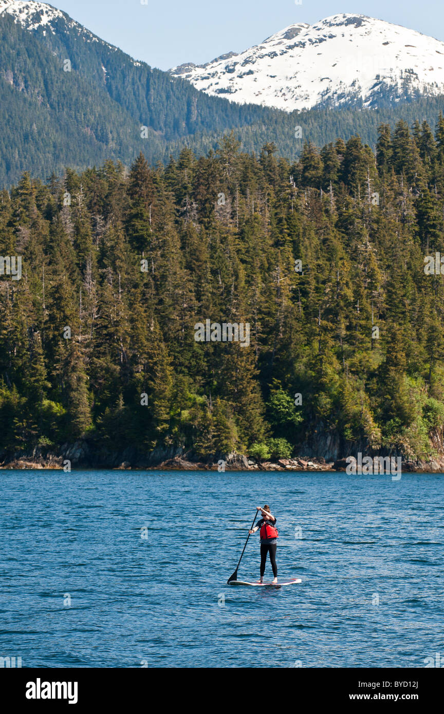 Young woman paddleboarder paddleboarding in Windham Bay in the Chuck ...